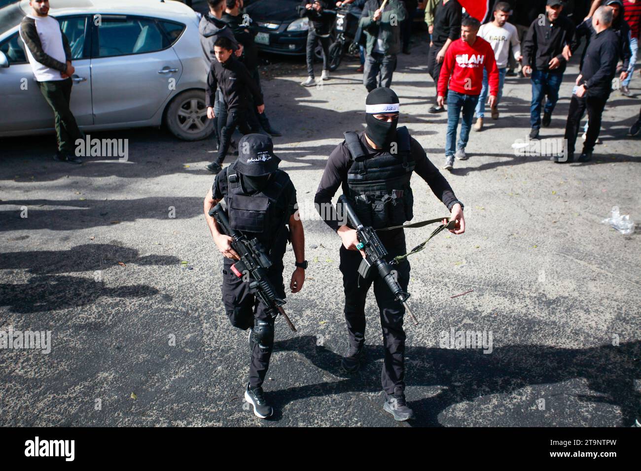 Jenin, Palestine. 26th Nov, 2023. Gunmen take part in the funeral of ...