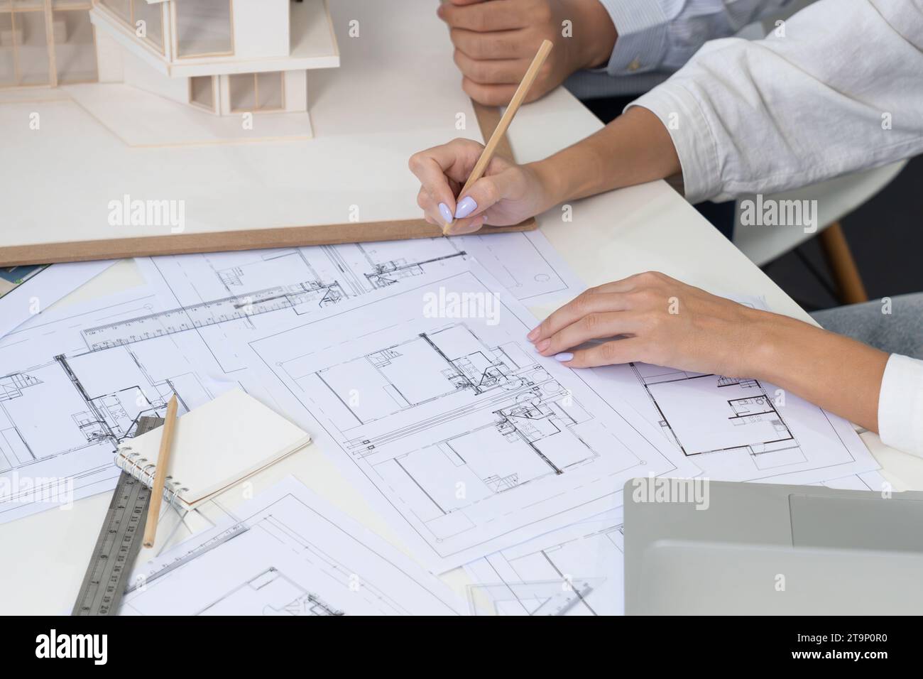 Top view image of professional beautiful young architect hand drafts ...