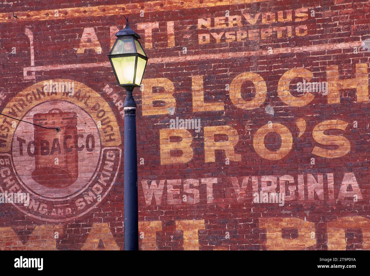 Painted brick advertisement with streetlamp, Jacksonville, Oregon Stock ...
