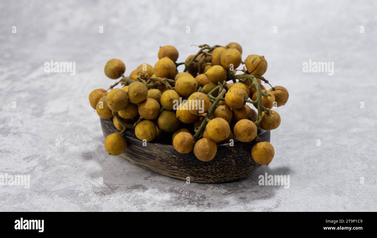 Baccaurea polyneura or buah jentik. This fruit with yellowish brown ...