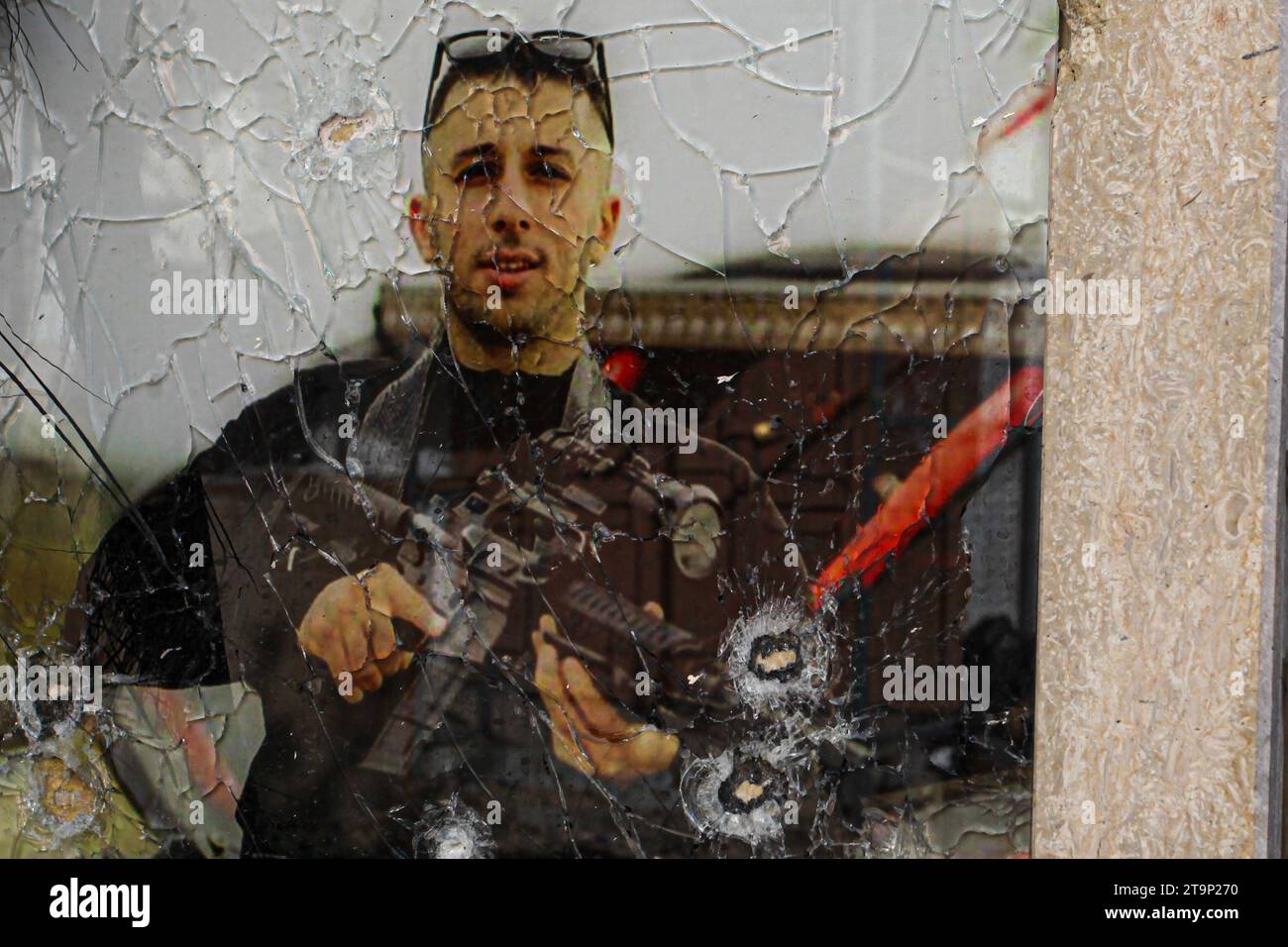 Jenin, Palestine. 26th Nov, 2023. A picture of a Palestinian gunman who ...