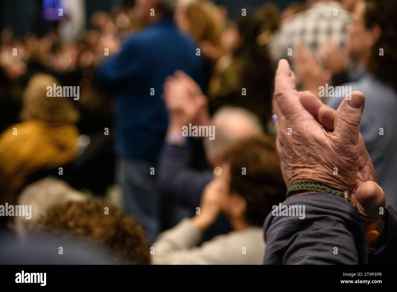 Israel. 26th Nov, 2023. People clap their handsas members of Kibbutz ...