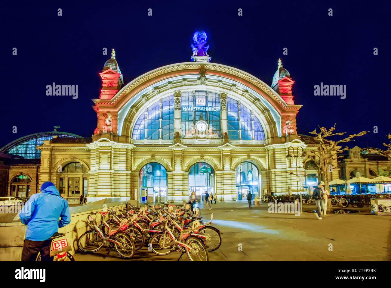 04-21-2016 Frankfurt, Germany. Man (his back) rents a bicycle (DB state ...