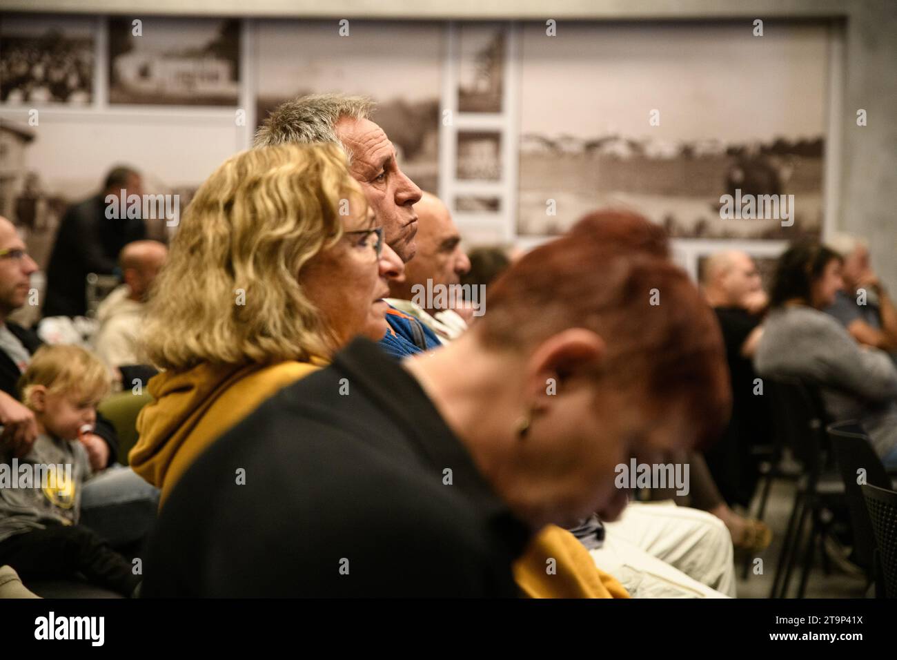 Israel. 26th Nov, 2023. Members of Kibbutz Kfar Azza gather to watch ...