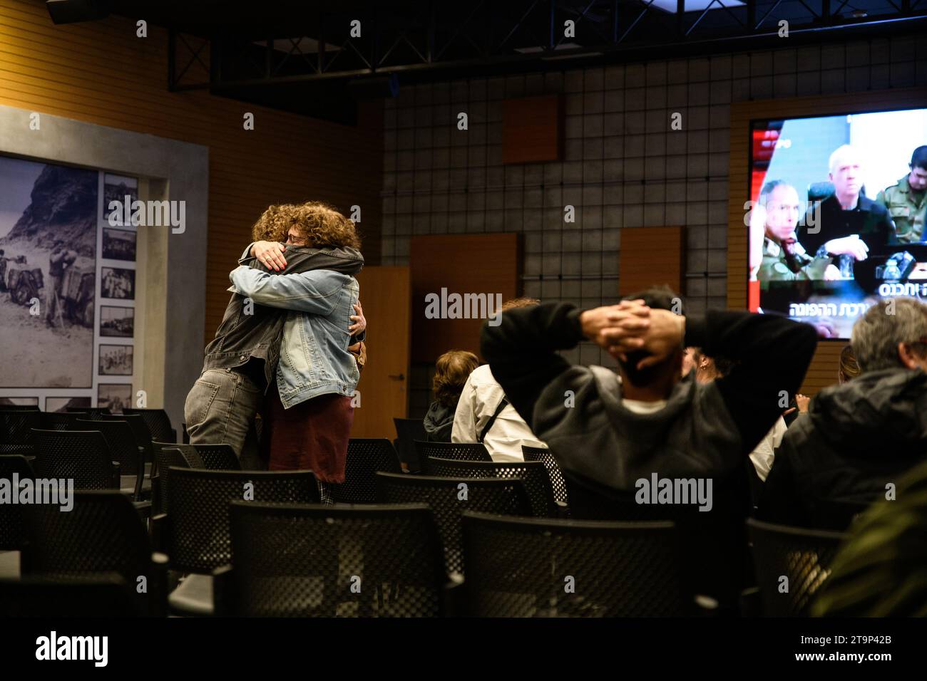 Israel. 26th Nov, 2023. Two woman hug as members of Kibbutz Kfar Azza ...
