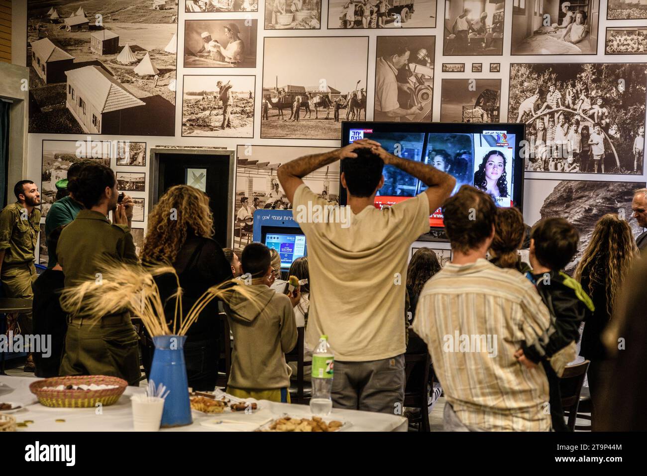 Israel. 26th Nov, 2023. Kibbutz member holds his head as 15 years old ...