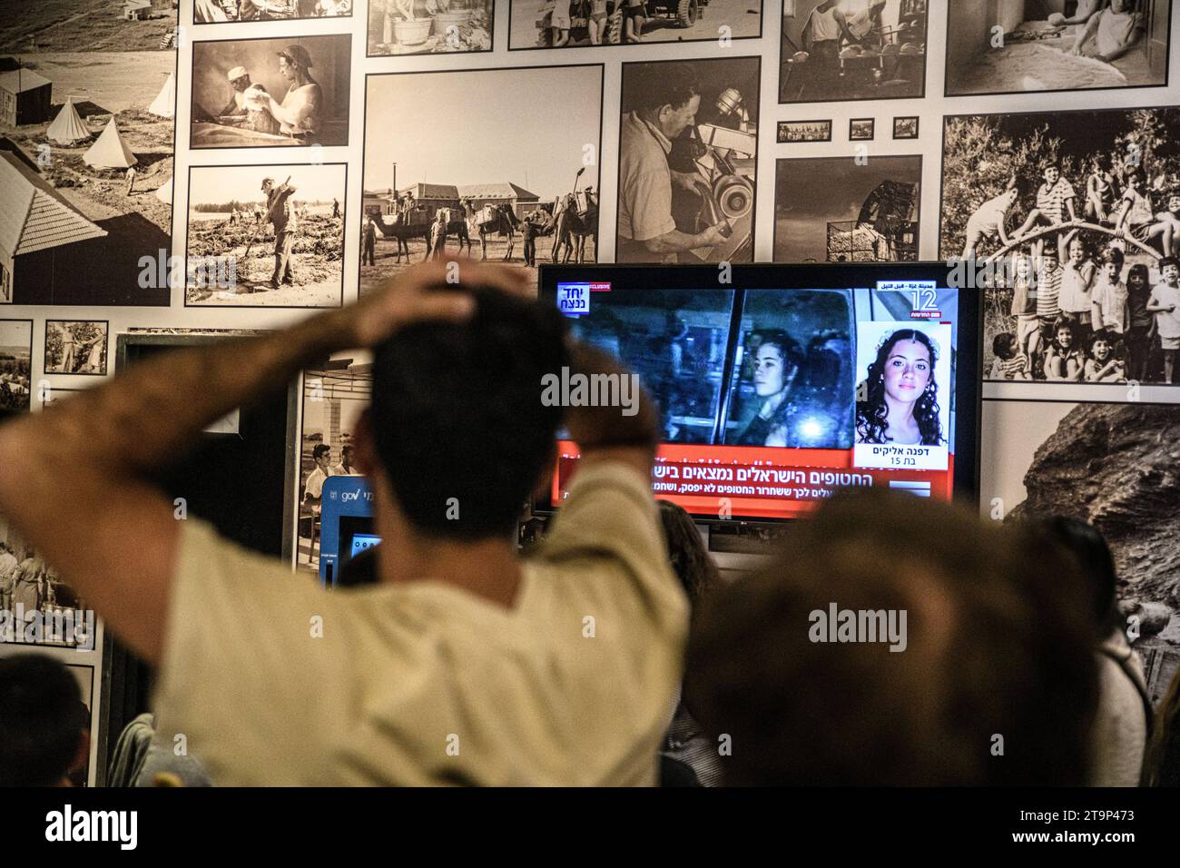Israel. 26th Nov, 2023. Kibbutz member holds his head as 15 years old ...