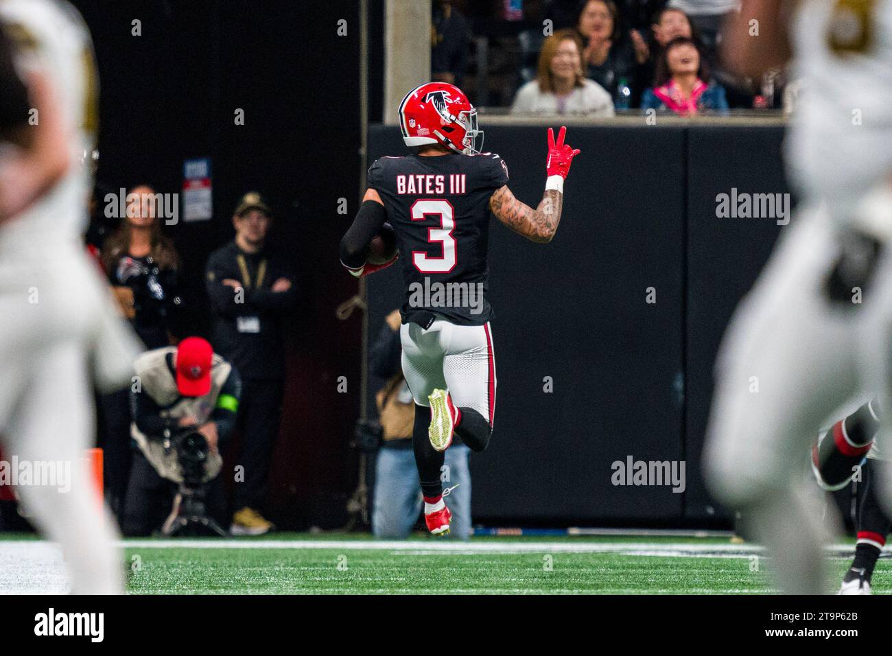 Atlanta Falcons safety Jessie Bates III (3) returns an interception for ...