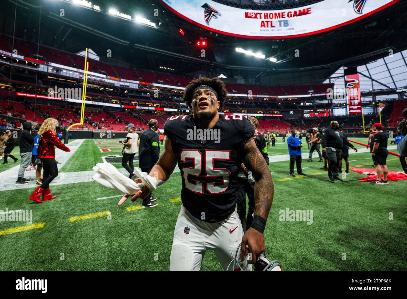 Atlanta Falcons running back Tyler Allgeier (25) walks off the field ...