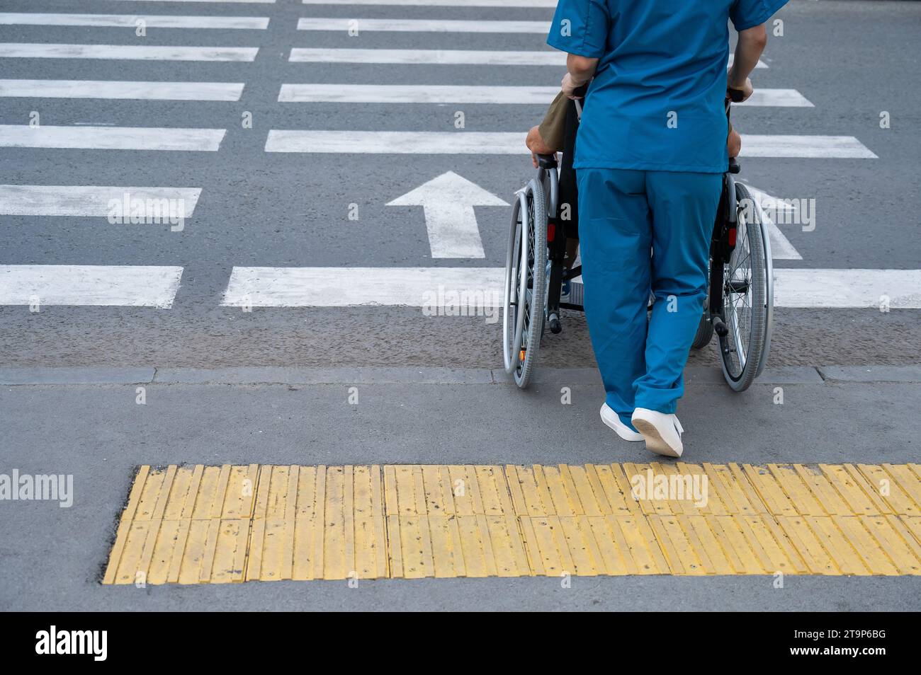 Helping elderly cross street hi-res stock photography and images - Alamy