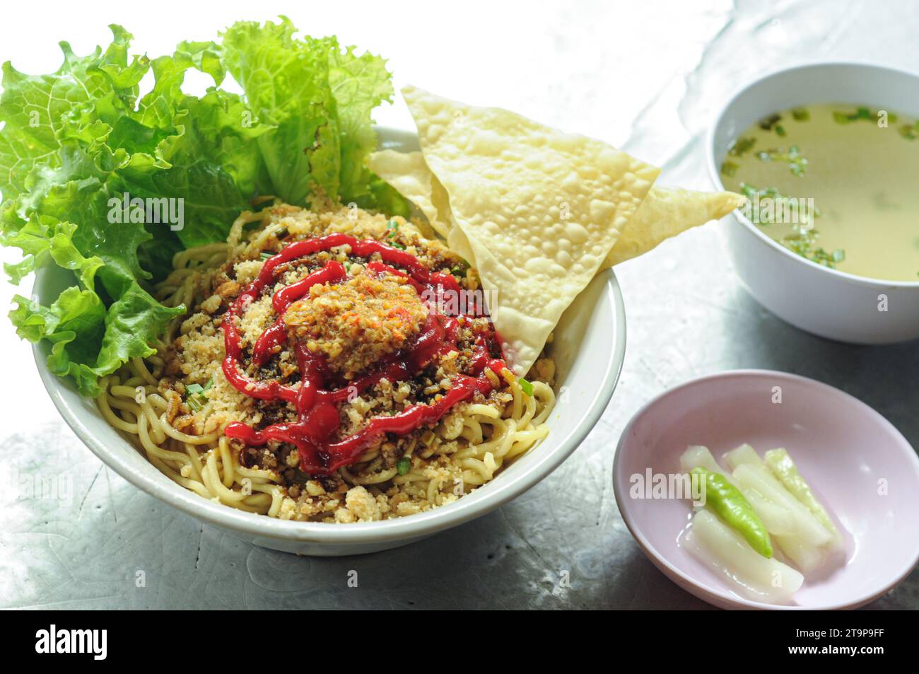 Mie ayam (noodles with chicken, meatballs, dumplings and vegetables) is ...