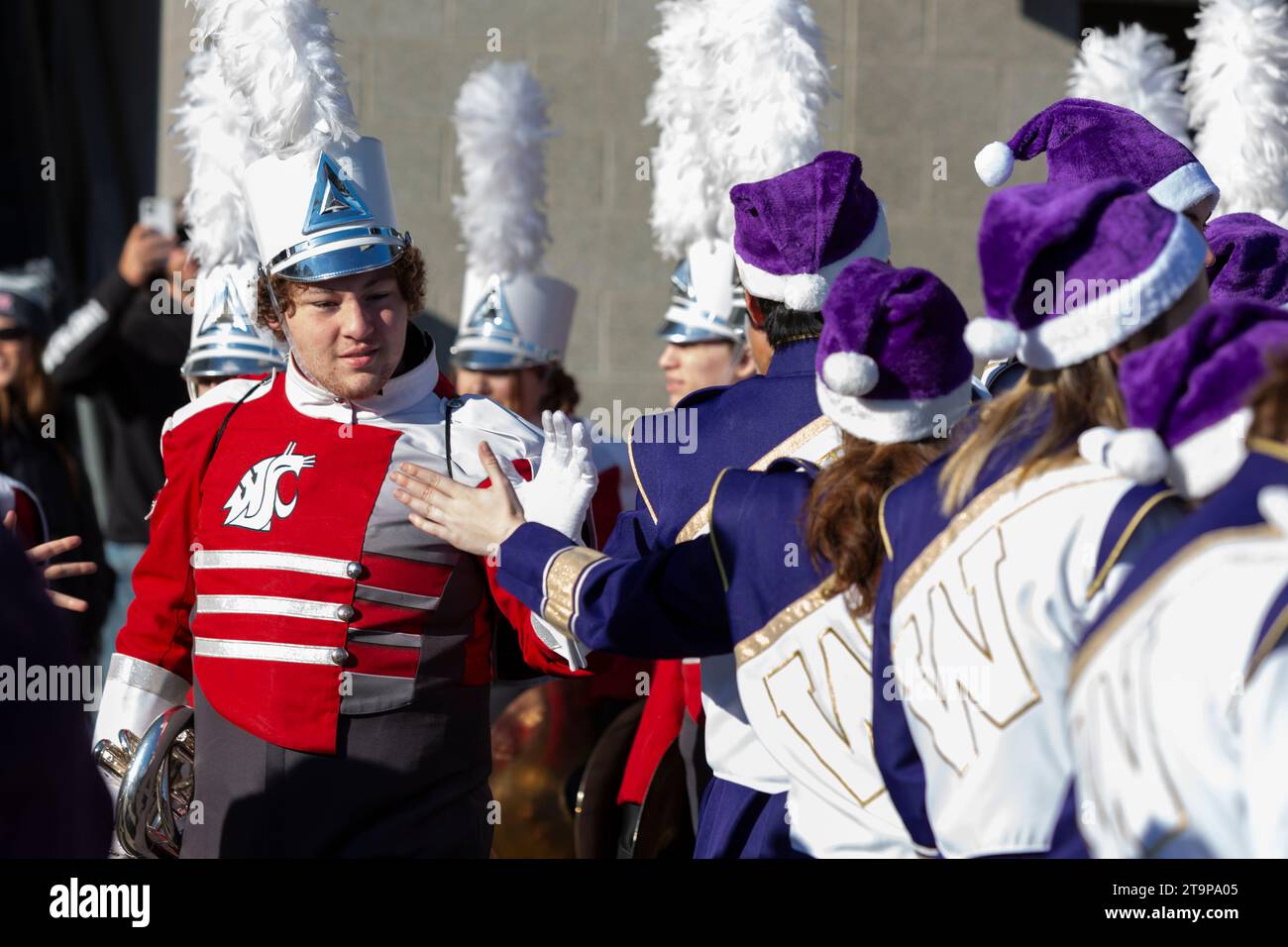 A member of the University of Washington Husky Marching Band offers a ...