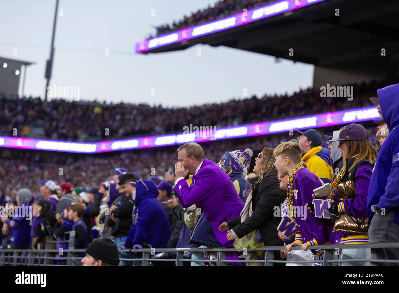 Washington Huskies fans cheer during the tense final few minutes of the ...