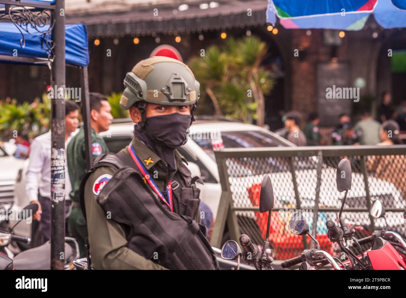Armed Cambodian police provide security at a checkpoint on the ...