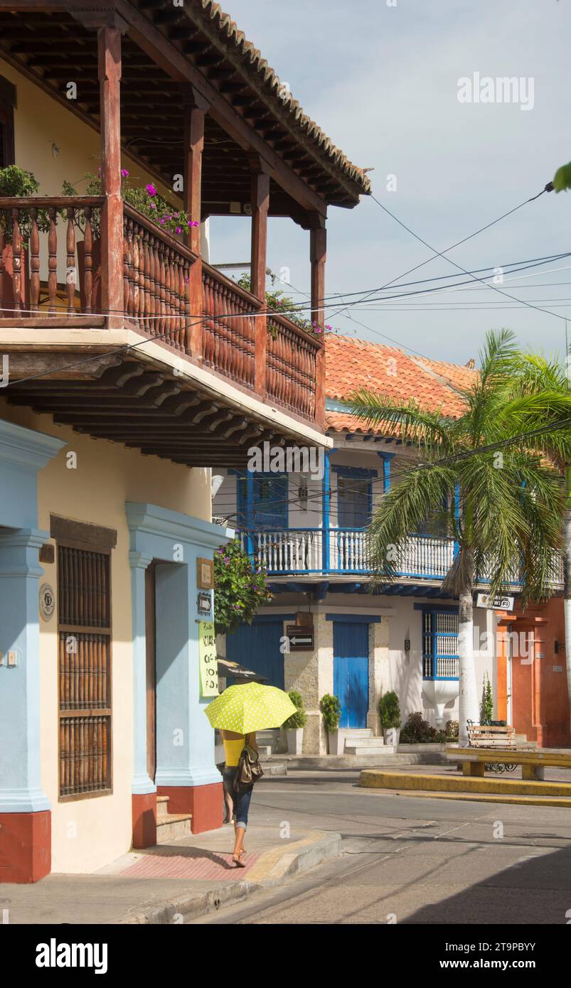 The undeniable Caribbean culture of Cartagena as a woman passes by ...