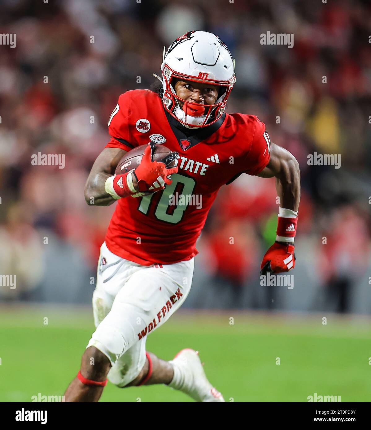 November 25, 2023: NC State freshman Kevin Concepcion (10) runs the ball. NCAA football game ...