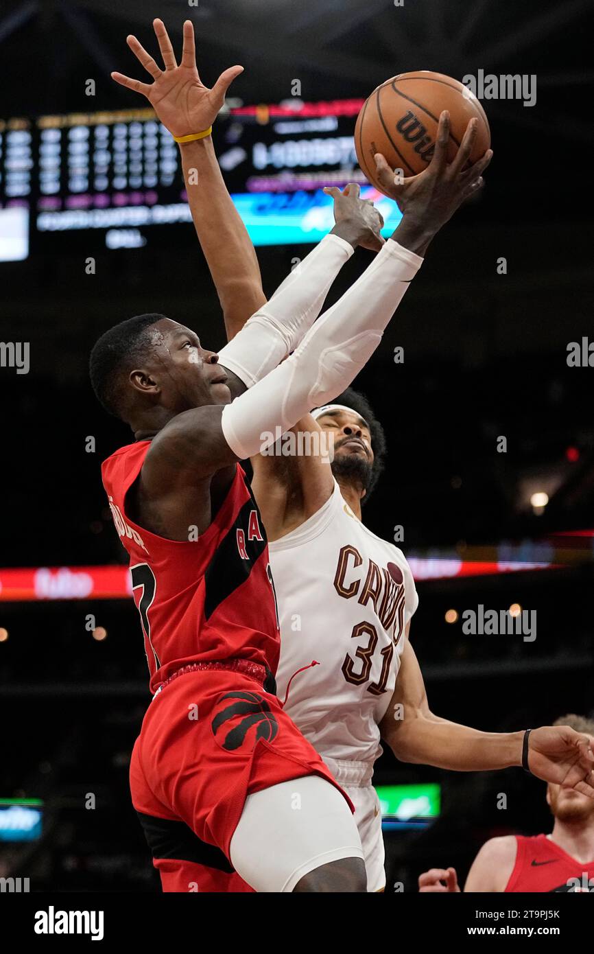 Toronto Raptors guard Dennis Schroder, left, goes to the basket while ...