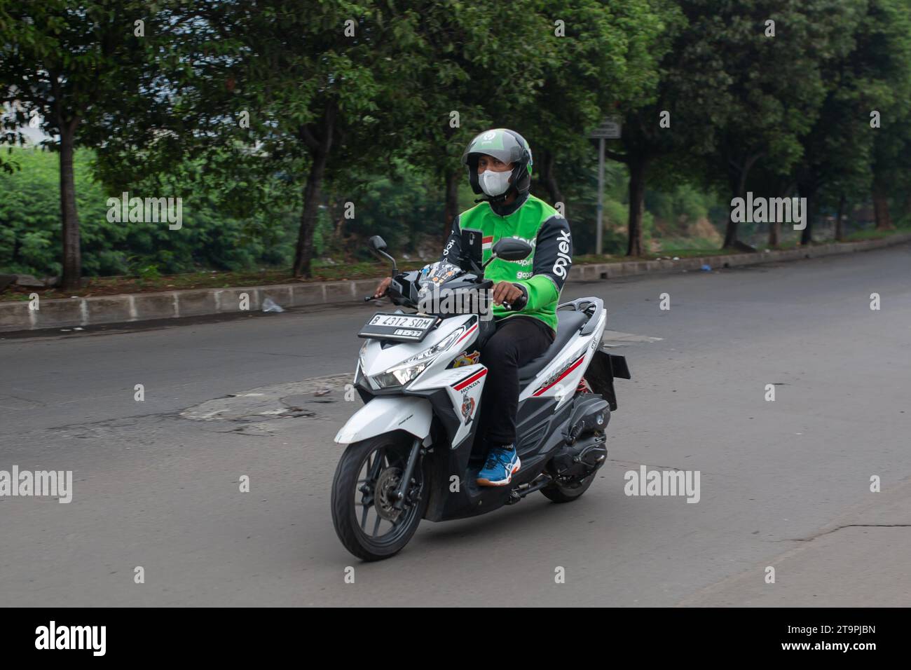 Jakarta, Indonesia - November 25, 2023: Gojek driver seen on the streets of Jakarta, Indonesia ...