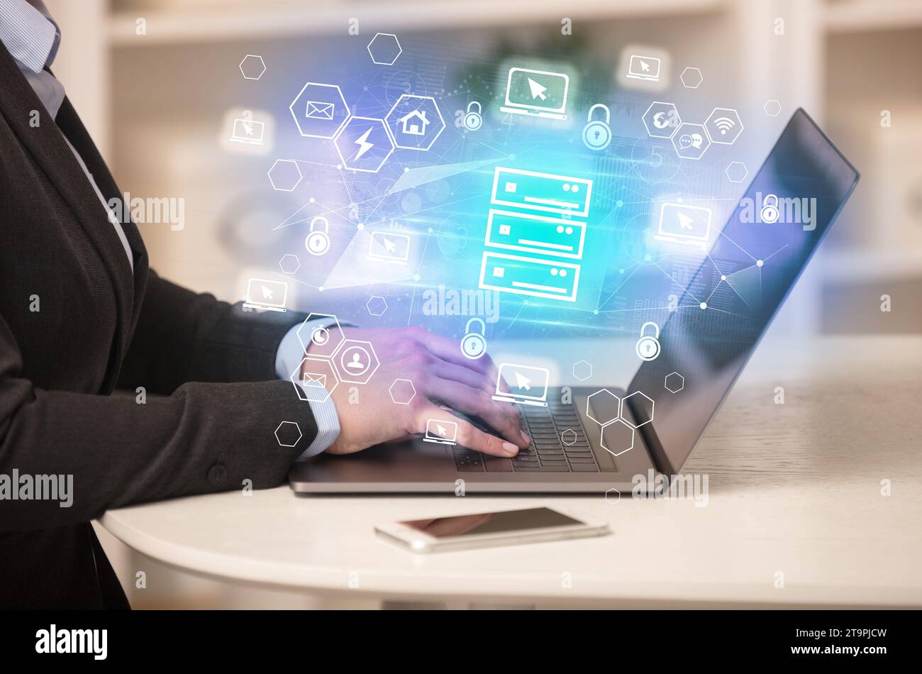 Hands working on laptop with digital icons Stock Photo - Alamy