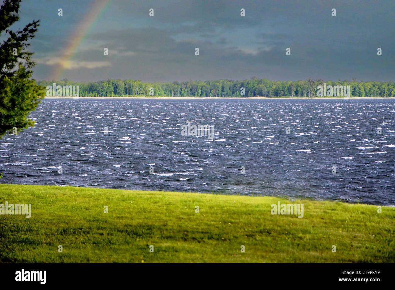 Stormy sky, wavy lake whitecap waves, rainbow background in the ...