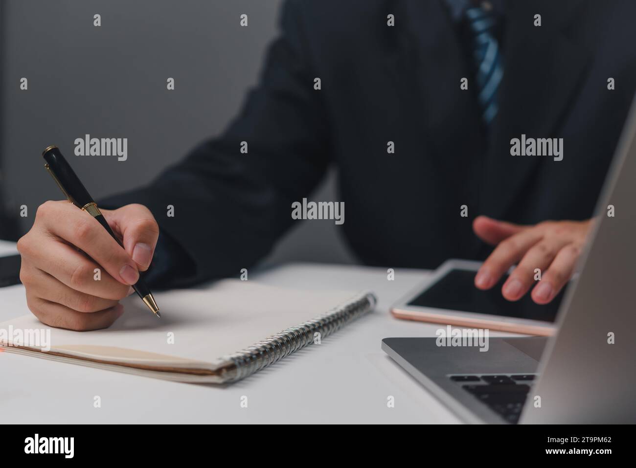 Hand holding pen checklist paper work on desk. Signing information ...