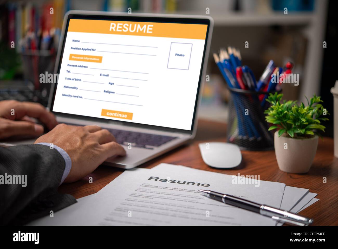 Man writing resume and CV Applicant searching for new work and typing ...