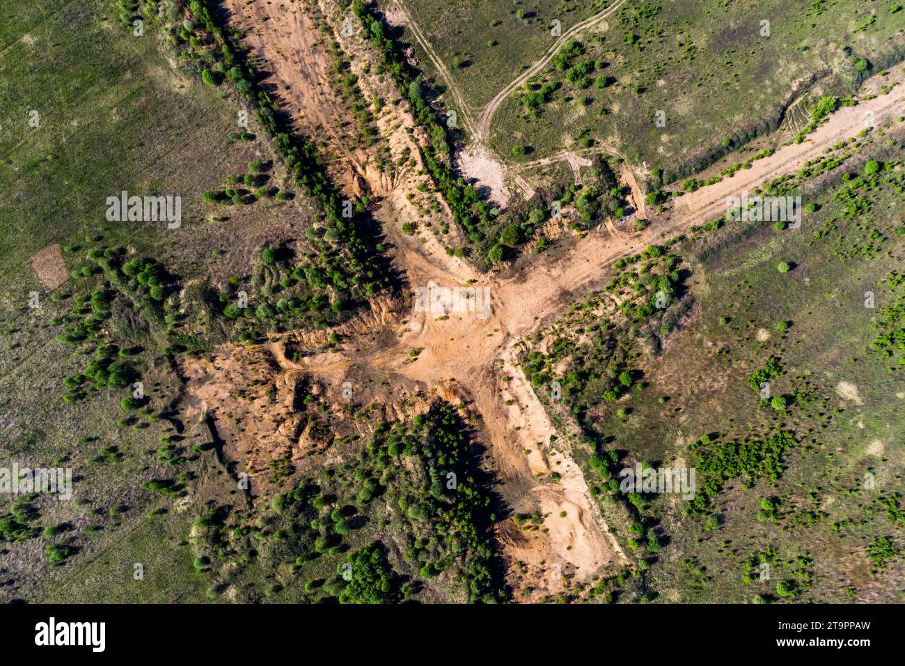 Aerial view of a cross-shaped exploration sand pit in a field Stock ...