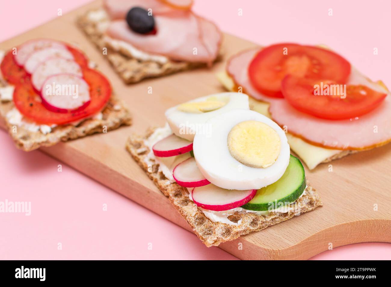 Different Whole Grain Crispbread with Ham, Tomato, Radish, Cucumber and ...