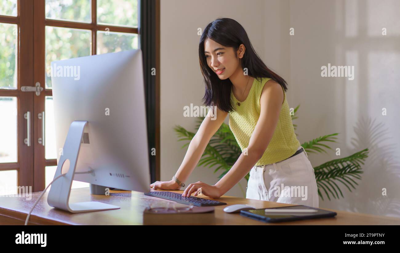 Hand embroidery concept, Women working on computer about design pattern ...