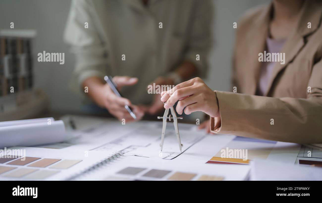 Two female architects discuss interior design building project and use ...