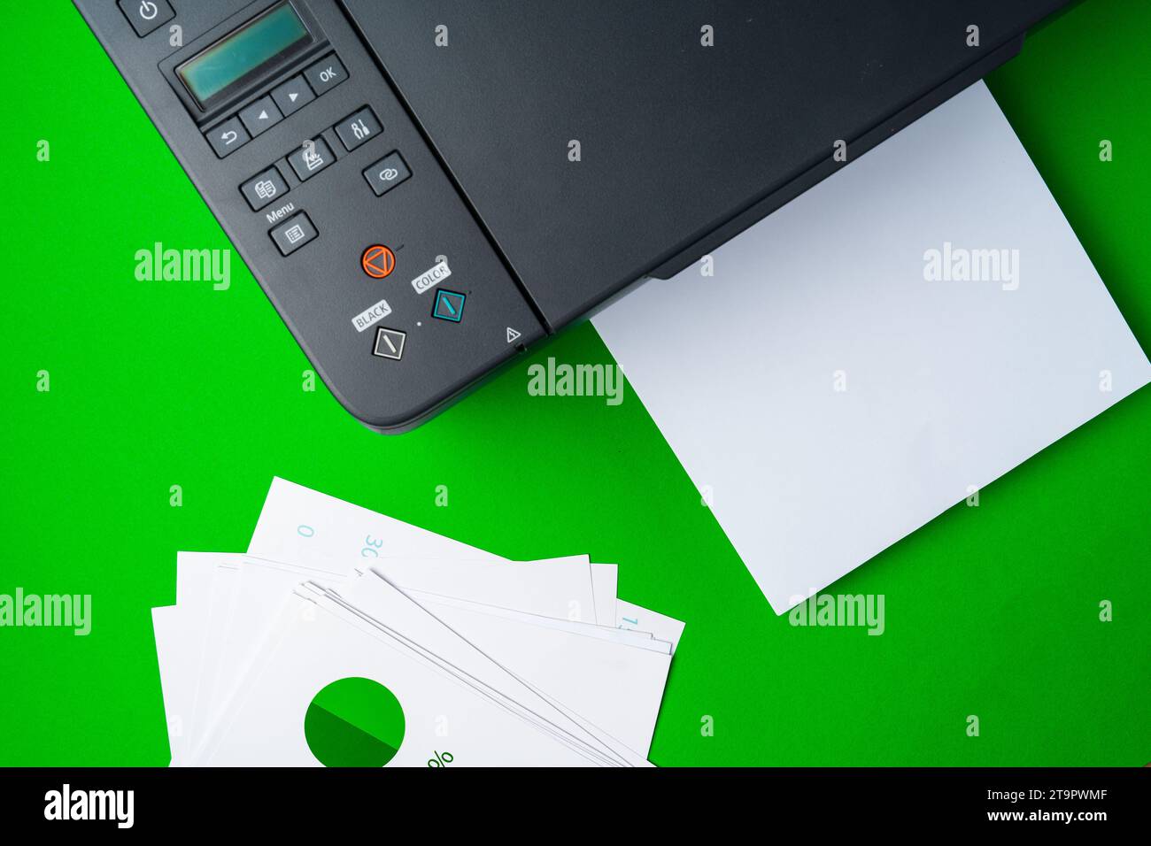 Modern printer with paper on green background Stock Photo - Alamy