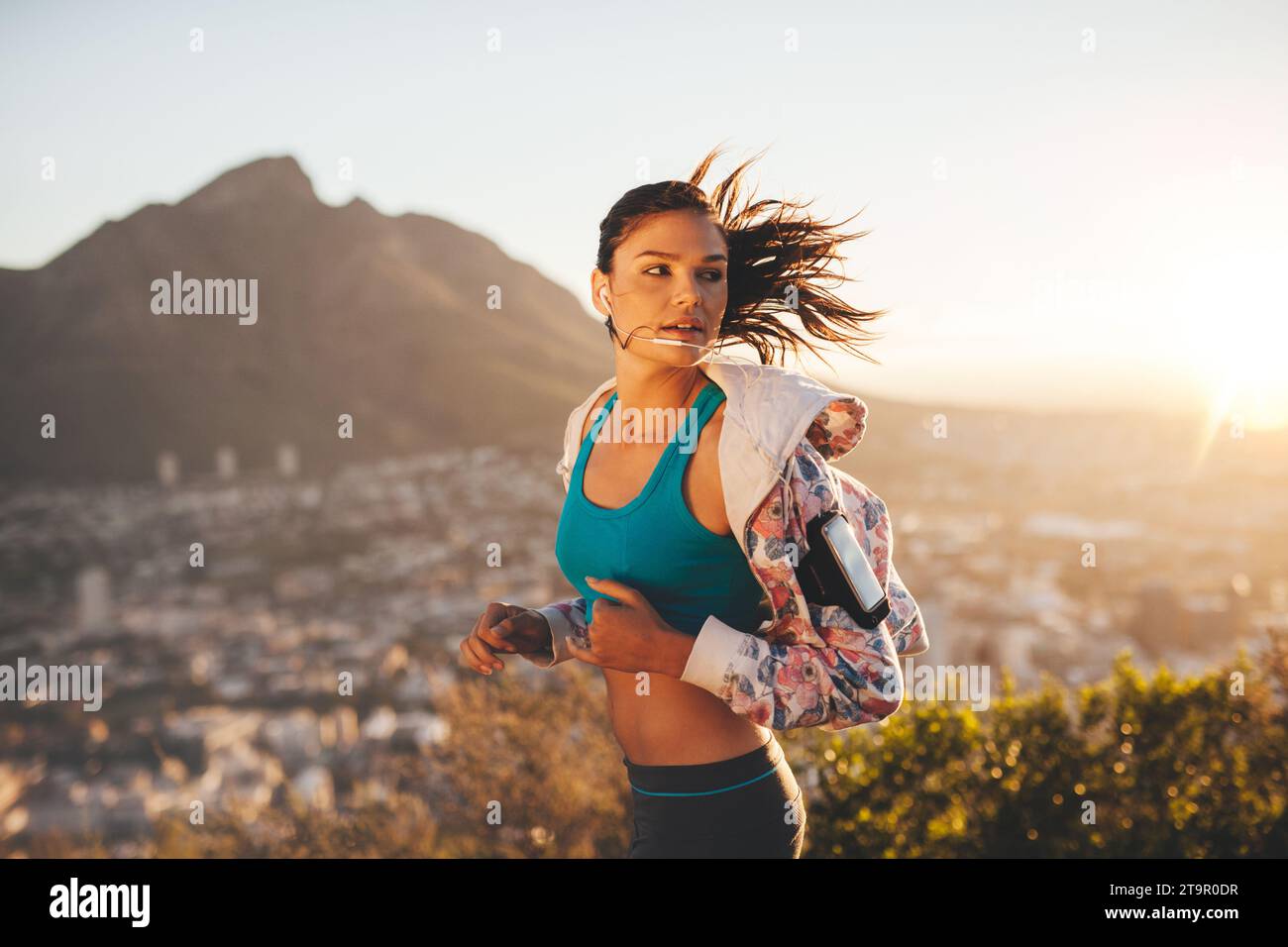 Female runner running outdoor in nature. Young woman jogging in morning ...