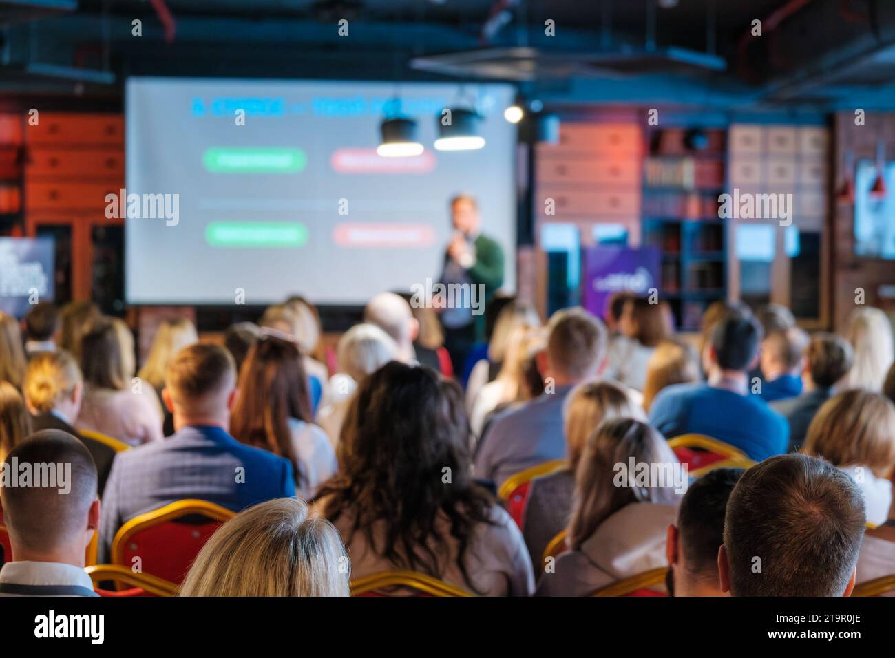Back view of diverse businesspeople attending global workshop in ...