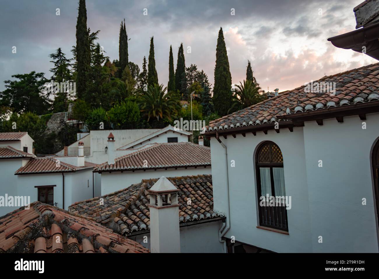 The beautiful stone buildings and tiled roofs in the old town ...