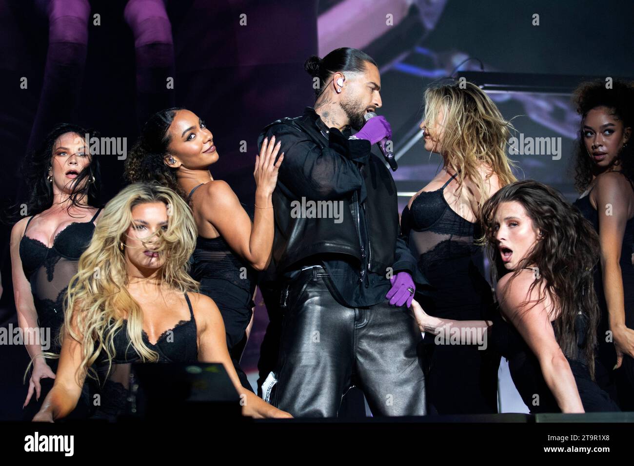 Colombian singer Maluma, center, performs during the Coca-Cola Flow ...