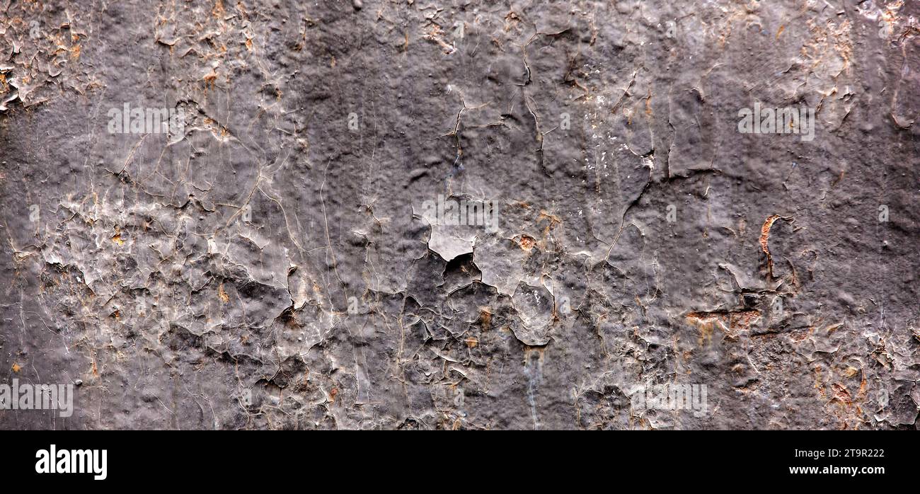 The Old black metal surface with cracked paint as background Stock ...