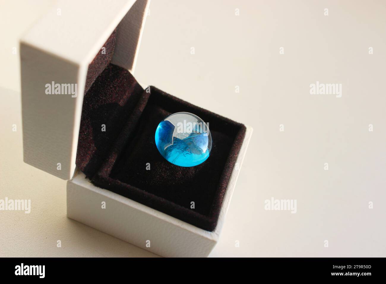White Cube Jewelry Box With Blue Crystal Smooth Stone Isolated Studio ...