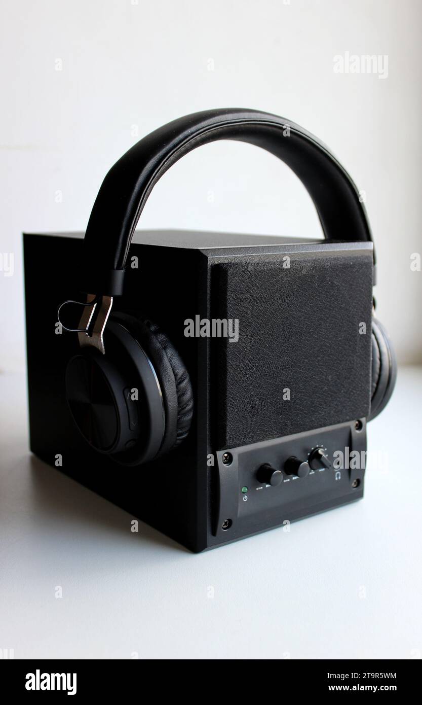 Modern Headset On A Square Loudspeaker With Control Buttons On A Front ...