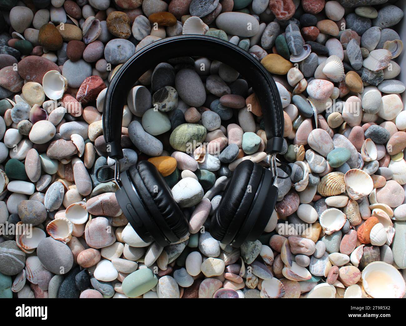 Black Headphones On A Round Colored Sea Stones Background As Symbol Of ...
