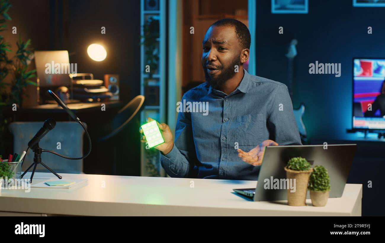 BIPOC tech content creator filming technology review of mini led lights ...