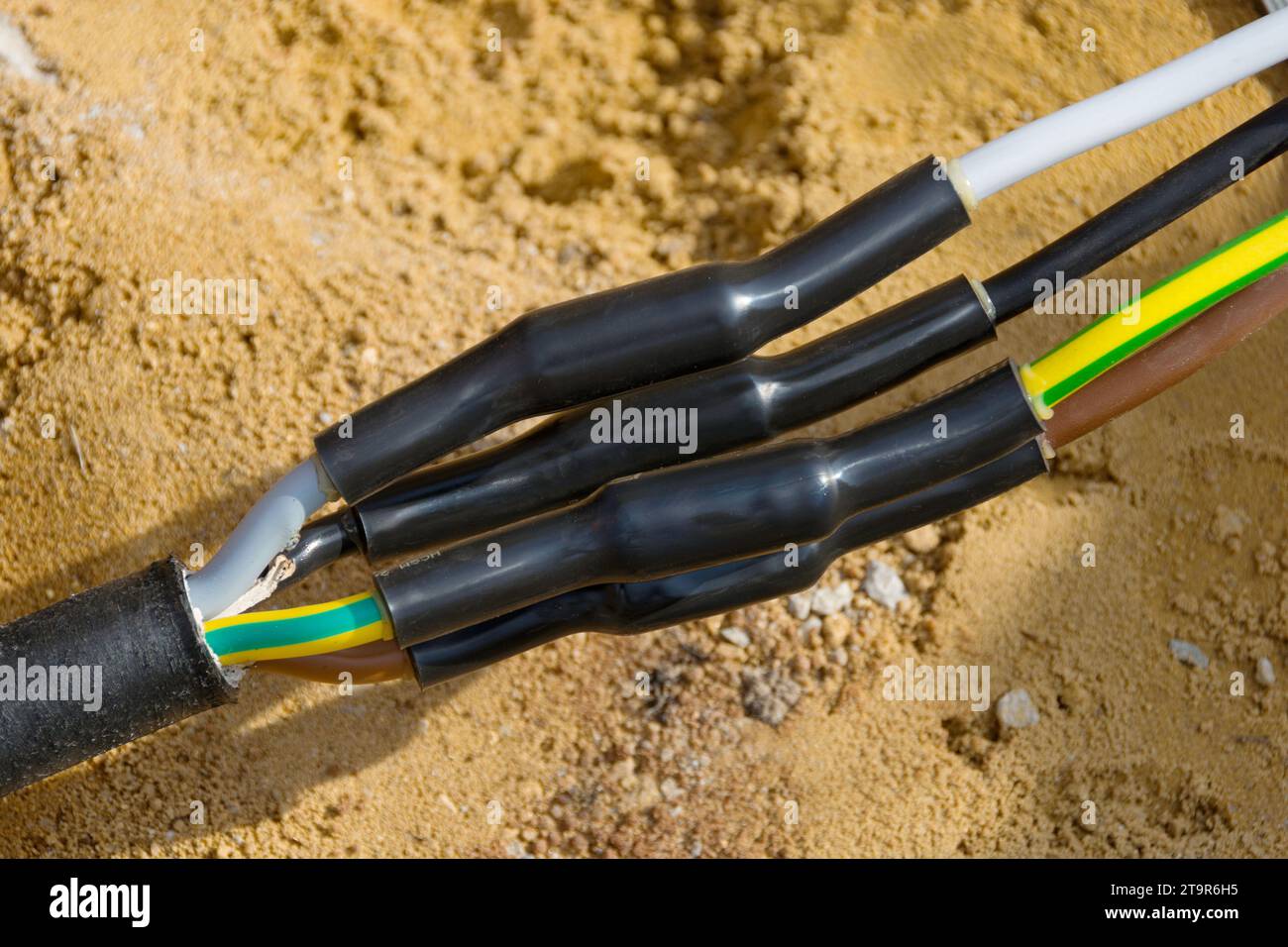 Connected power cables for house connections in the ground with shrink ...