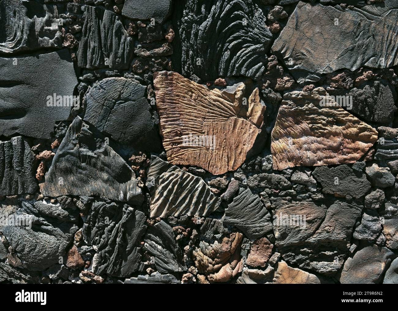 Wavy and jagged rigid lava volcanic wall distinctive pores with ...