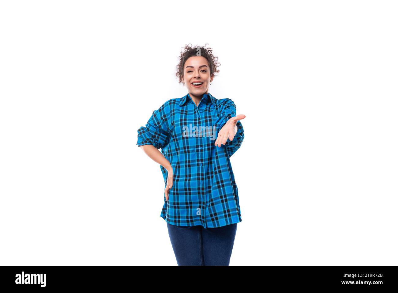 european friendly young lady with curly ponytail hairstyle dressed in a ...