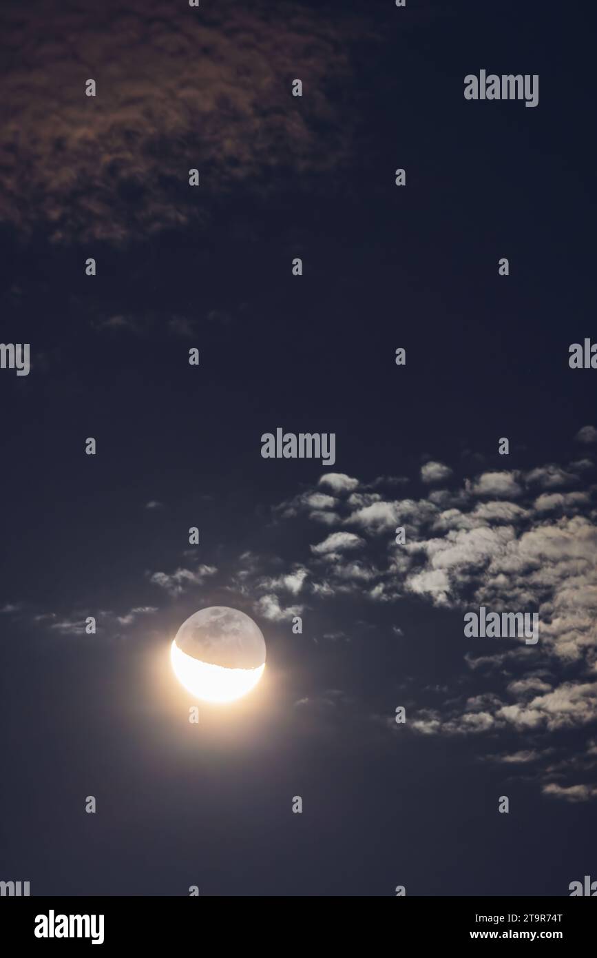 Full moon twilight with craters on the surface and dark sky, close up ...