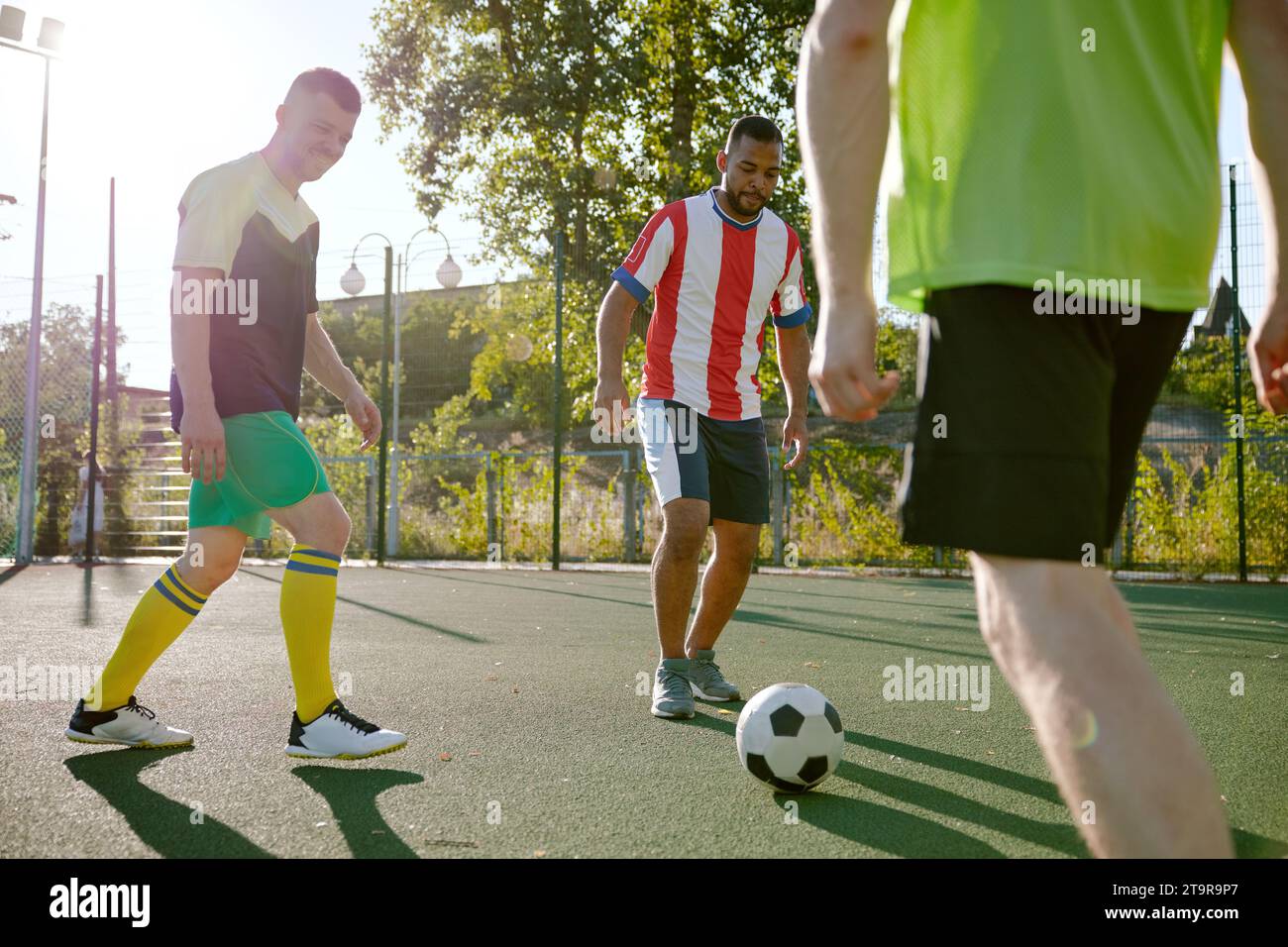 Street football on city soccer field at summer day Stock Photo - Alamy