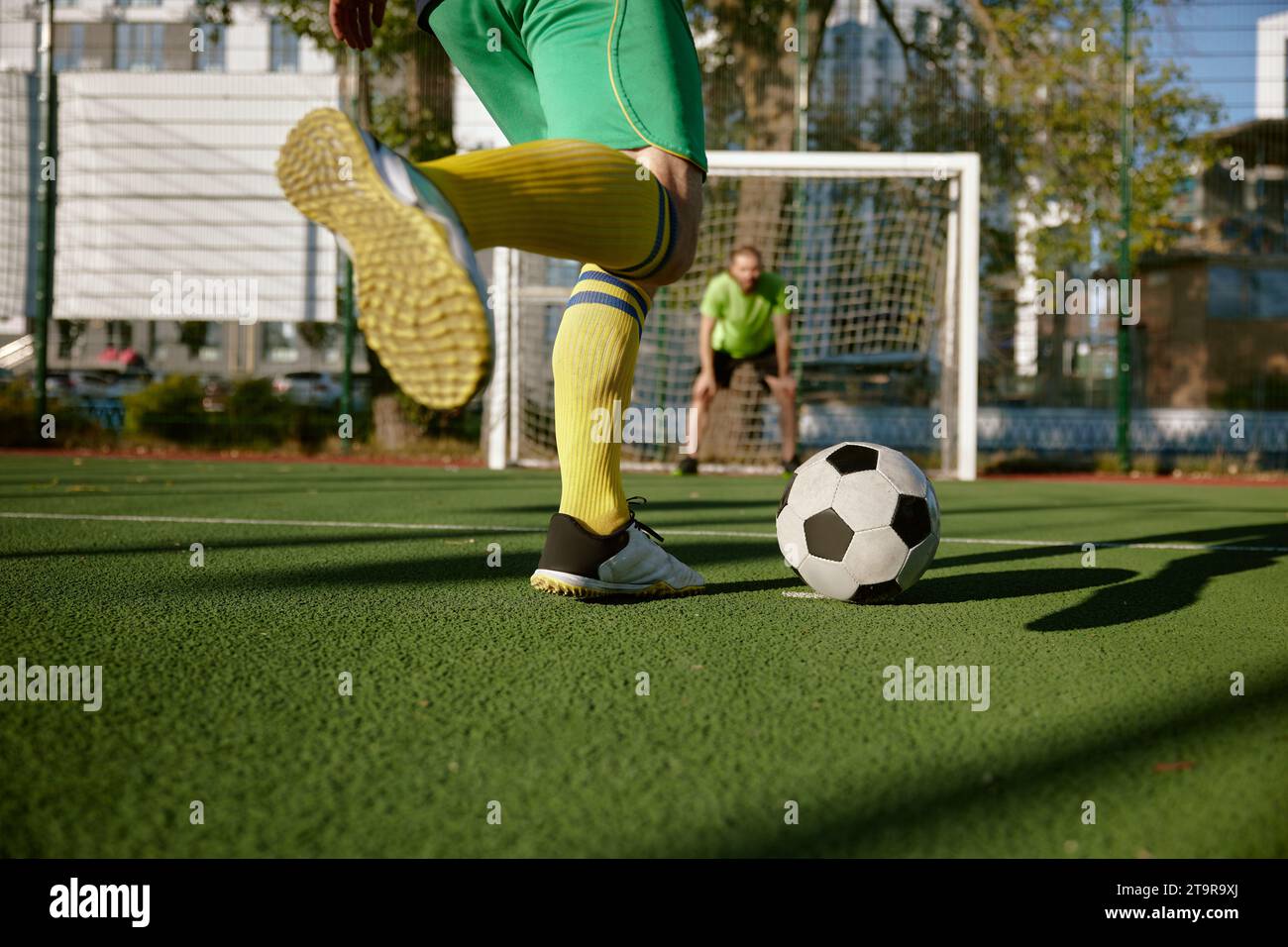 Football player aiming soccer ball trying to score goal Stock Photo - Alamy