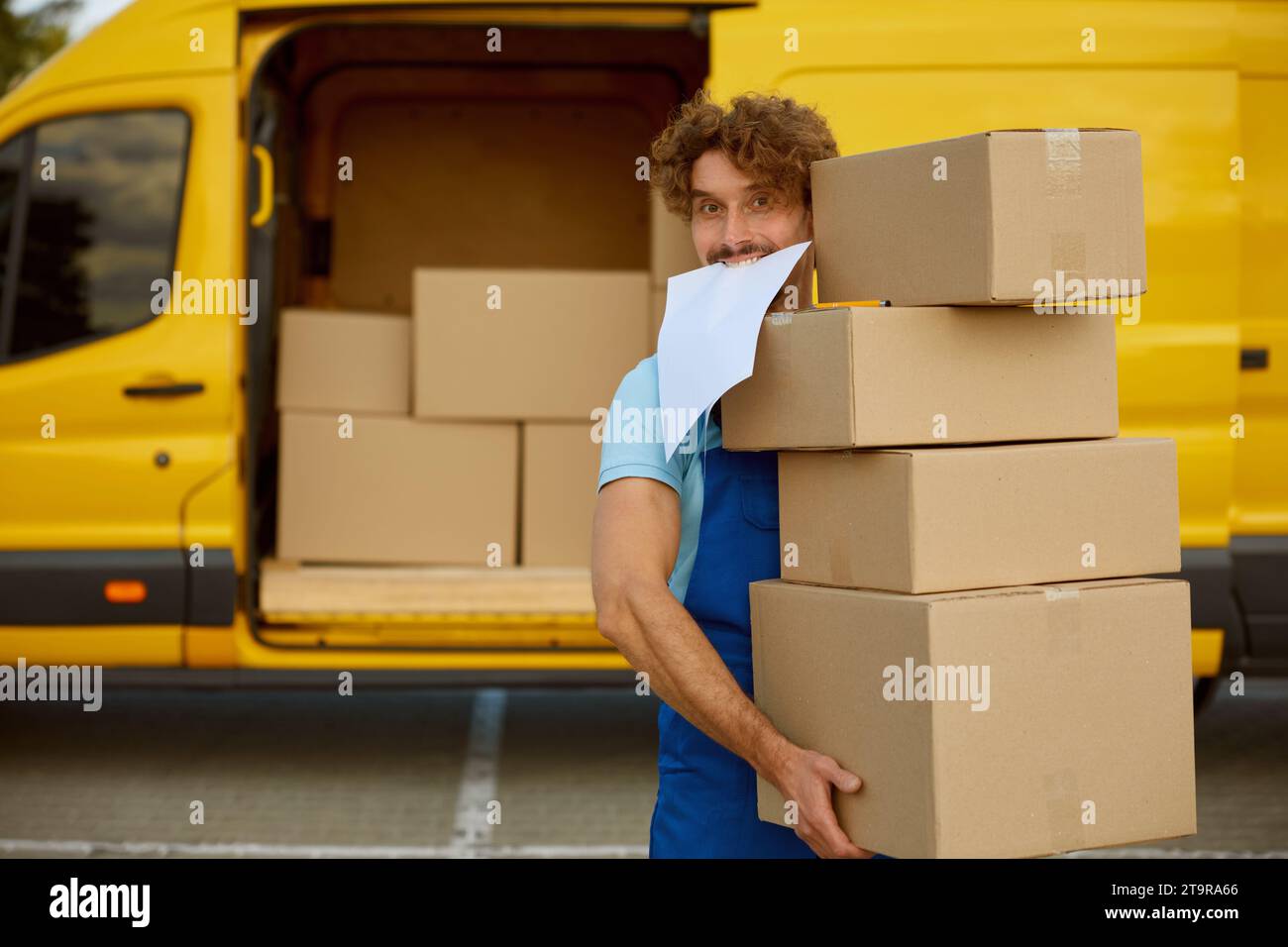 Funny deliveryman carrying pile of cardboard boxes providing ...