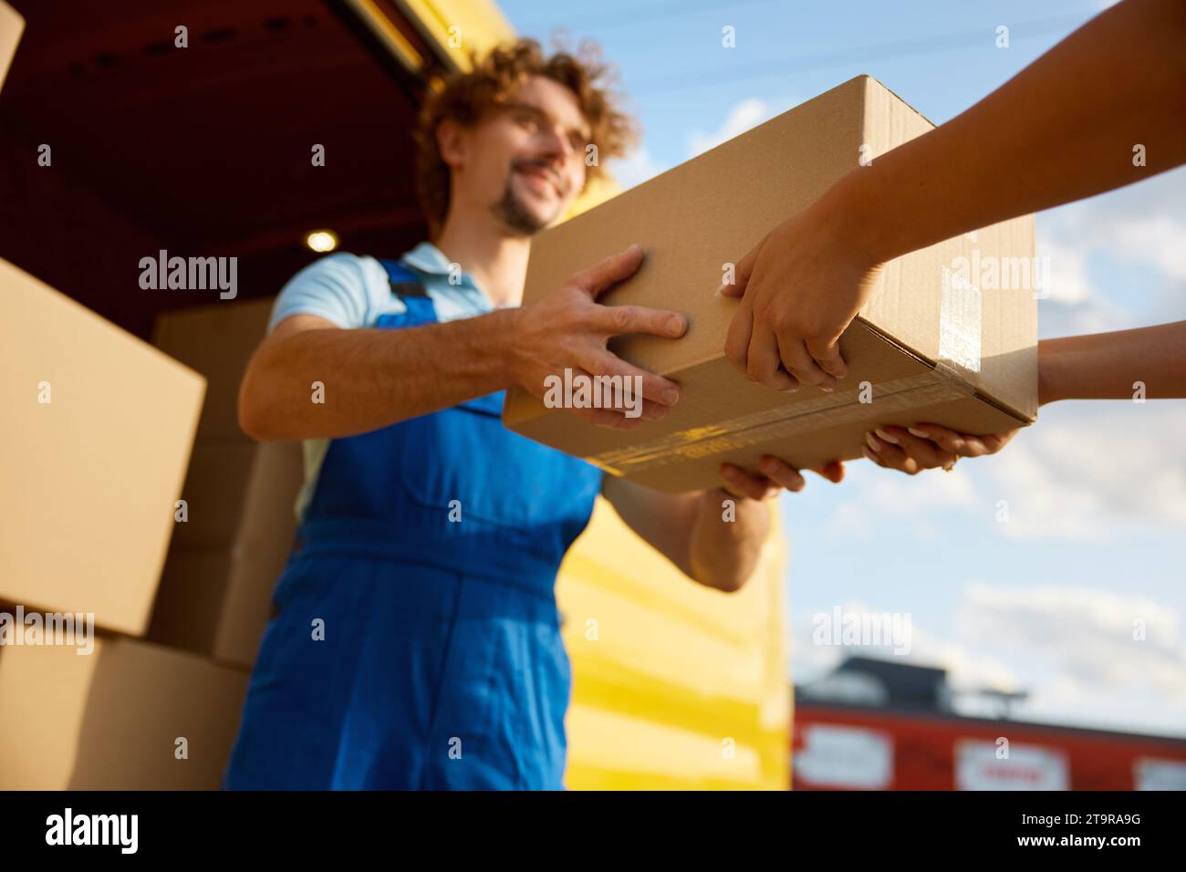 Closeup transferring of parcel cardboard box from hand to hand Stock ...