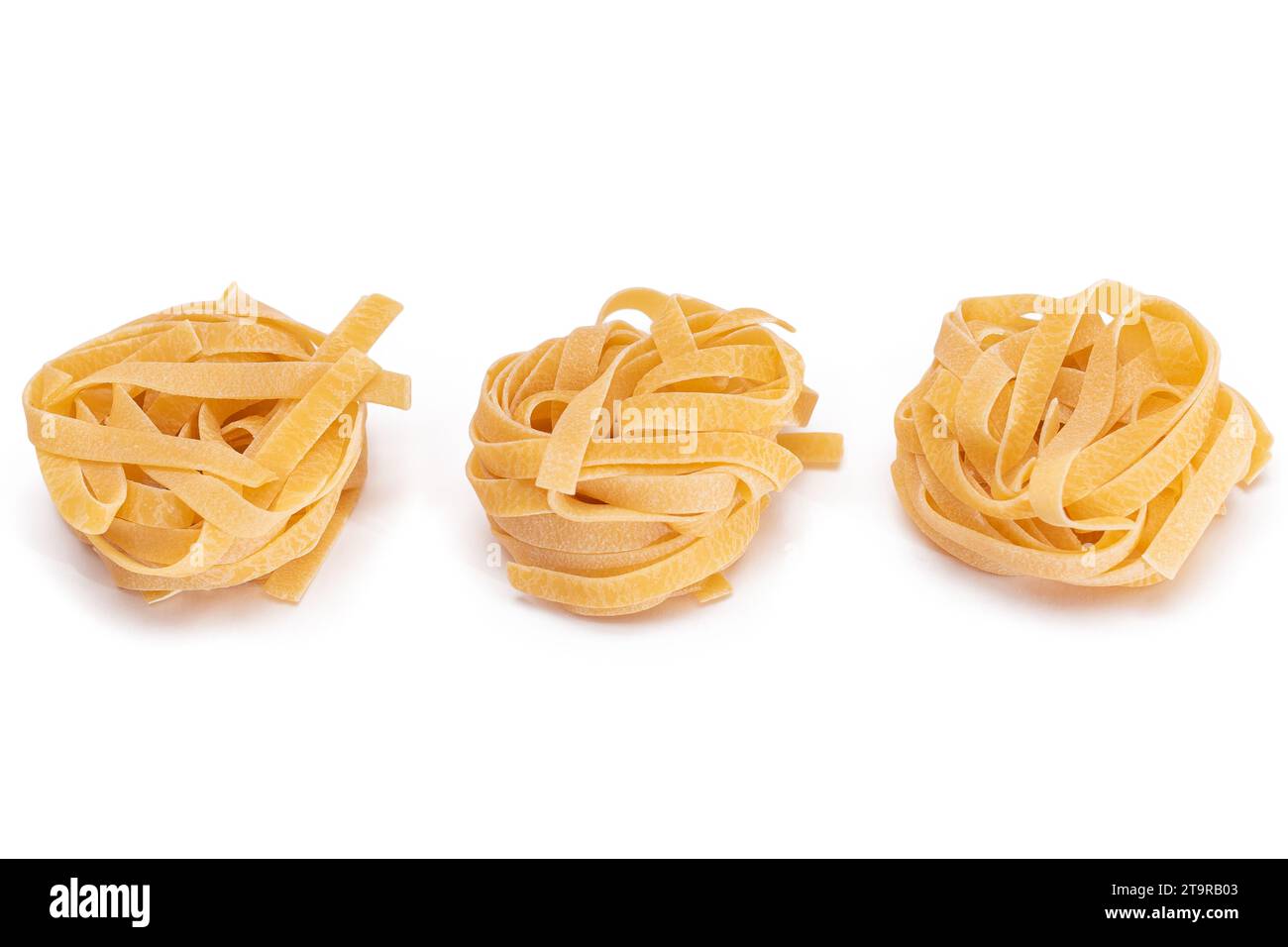 Three Classic Italian Raw Egg Fettuccine - Isolated on White Background ...