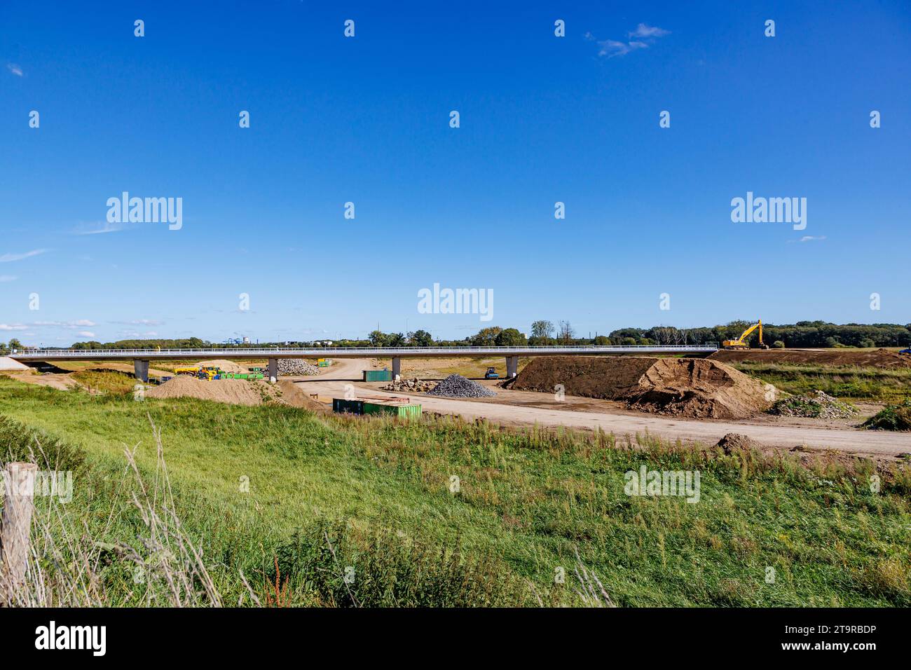 Landscape of rural road construction work area, a bridge, dirt road ...